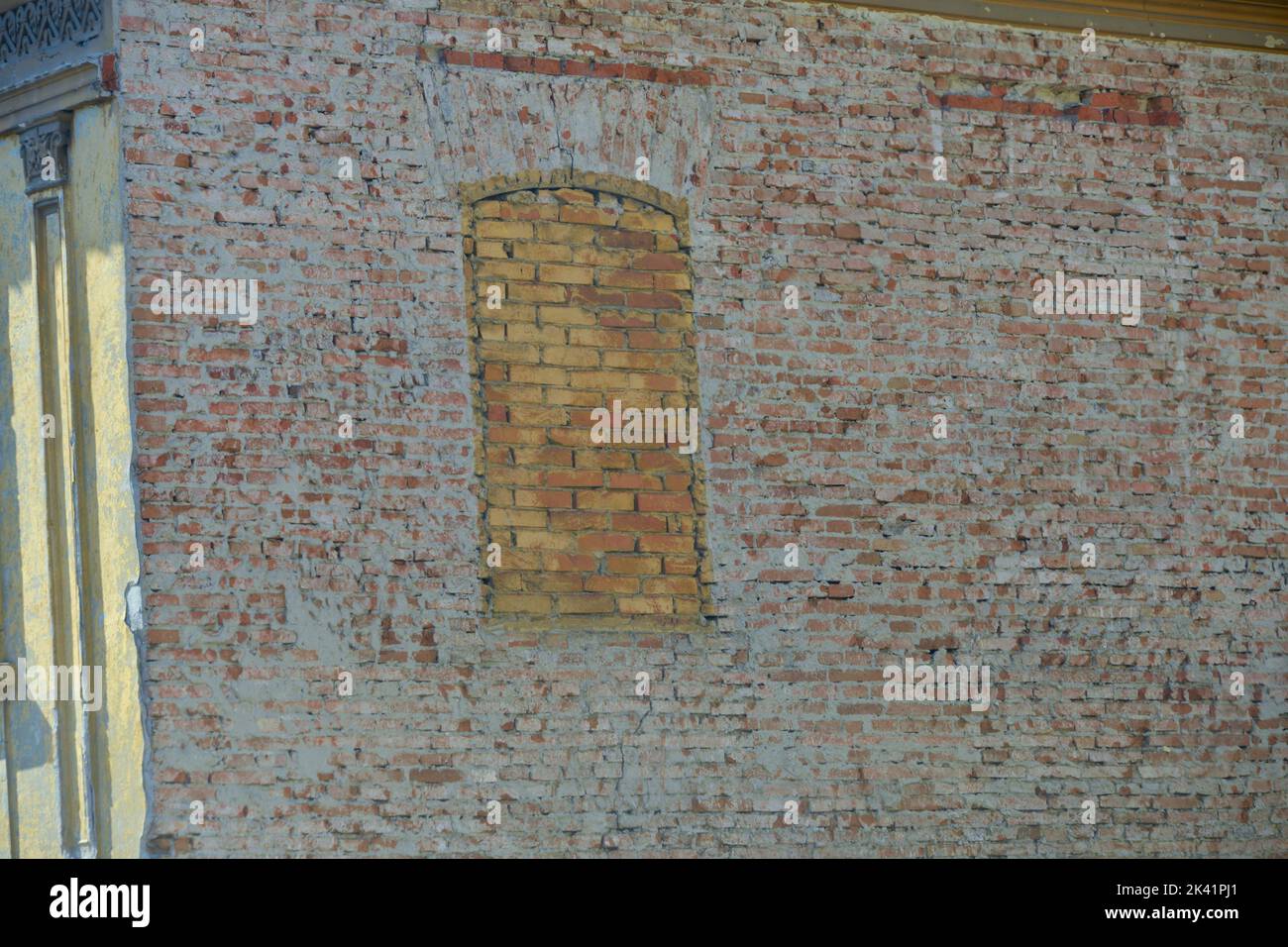 Ancient wall with a window filled with bricks Stock Photo - Alamy