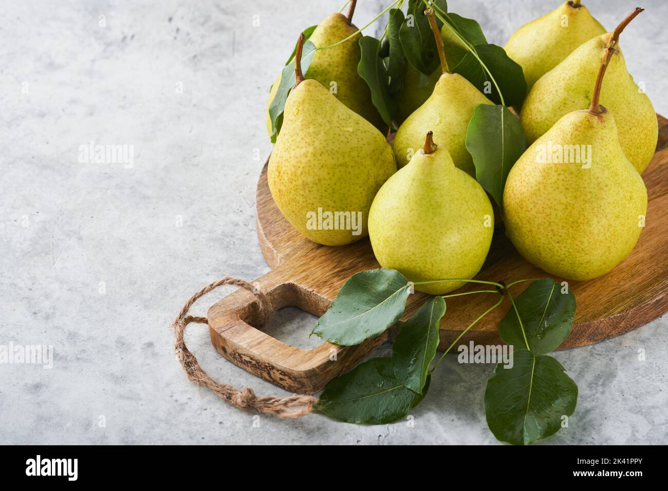 Pears. Fresh sweet organic pears with leaves on stand or plate on old ...