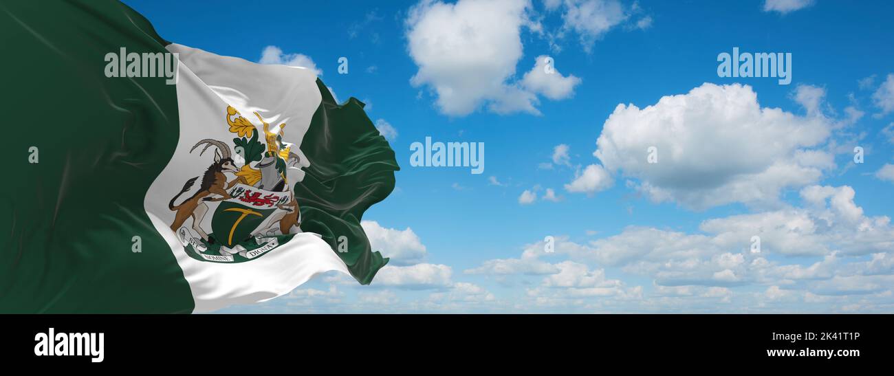 flag of Rhodesia 1968 1979, africa at cloudy sky background, panoramic ...