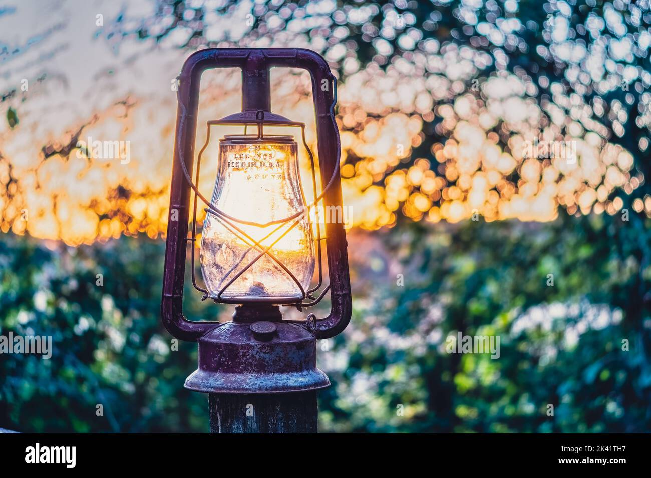 Antique Oil lamp on a post at sunset with colorful background Stock ...