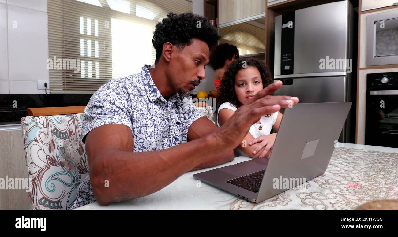 African father teaching daughter child to use laptop computer Stock ...