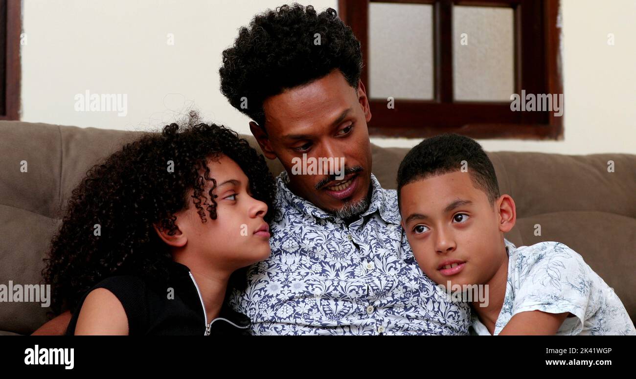 African father speaking with children giving parenting guidance Stock ...
