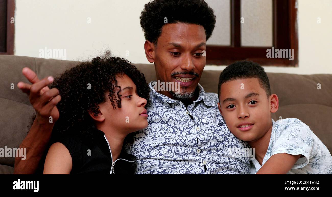 African father speaking with children giving parenting guidance Stock ...