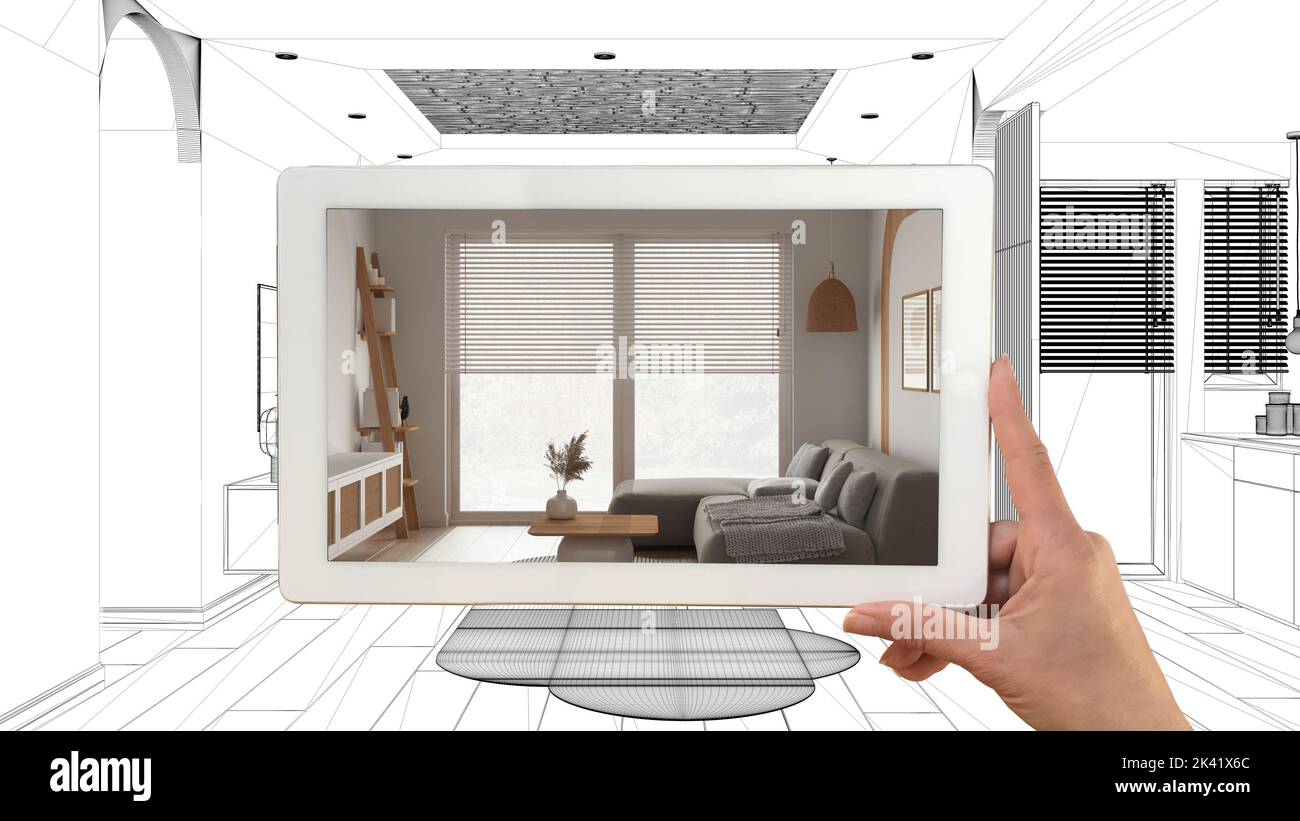 Augmented reality concept. Hand holding tablet with AR application used ...