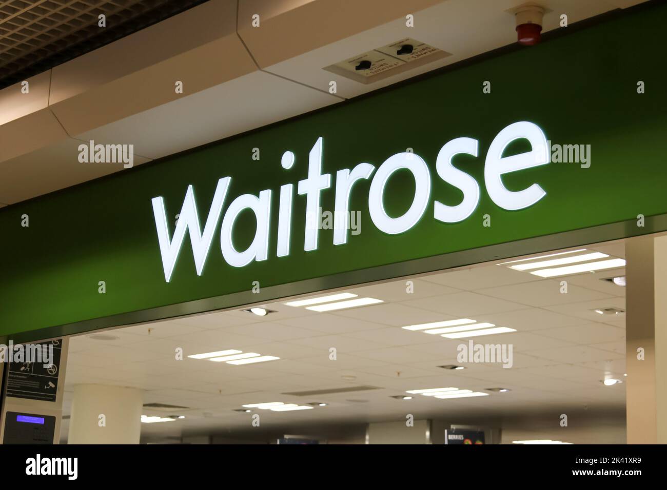 Waitrose supermarket sign inside Ashley Centre shopping centre, Epsom ...