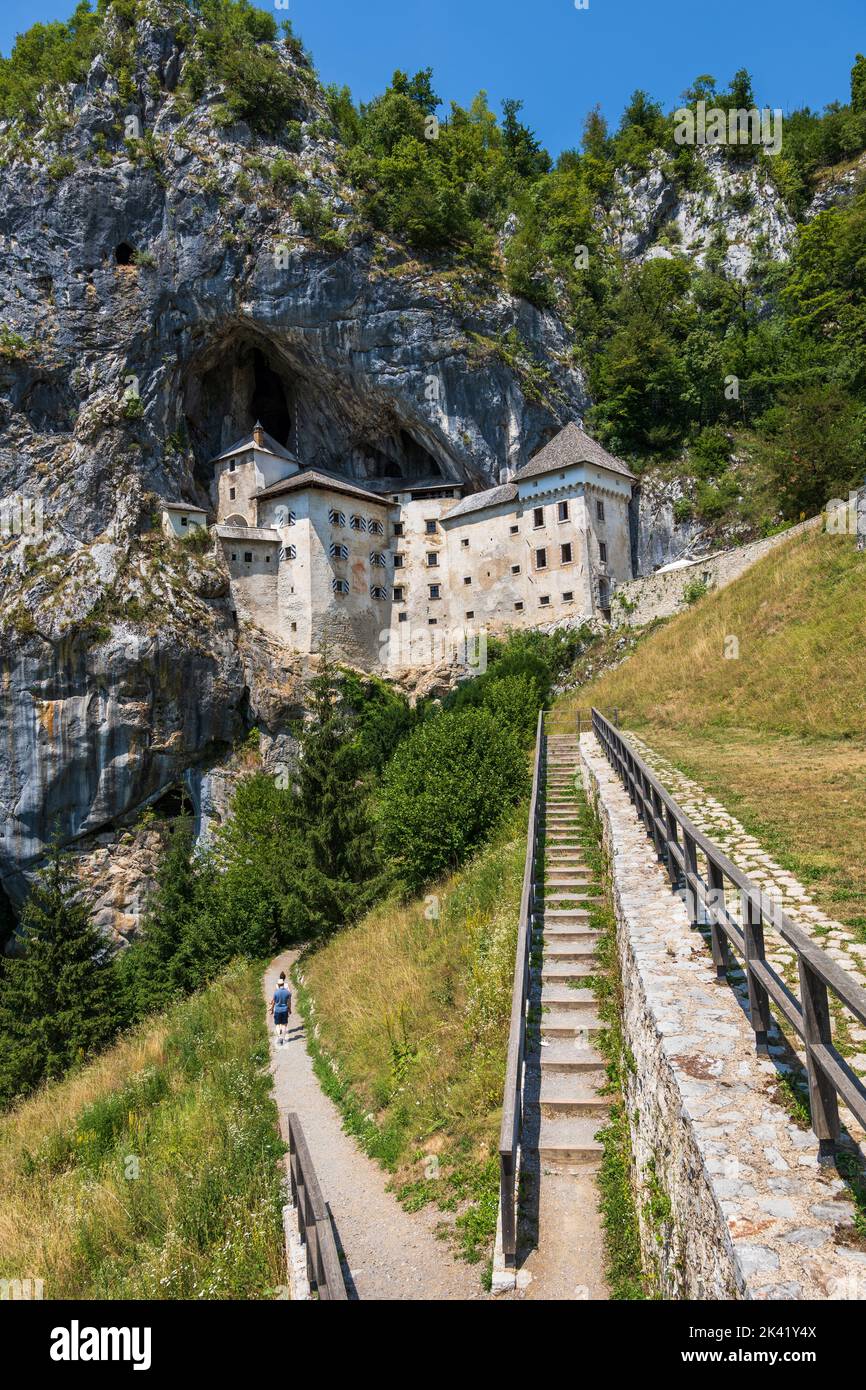 The Predjama Castle in Slovenia, hillside path and stairs to the ...