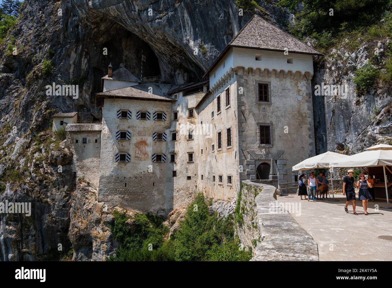 The Predjama Castle in Slovenia, medieval cave castle perched in cliff ...