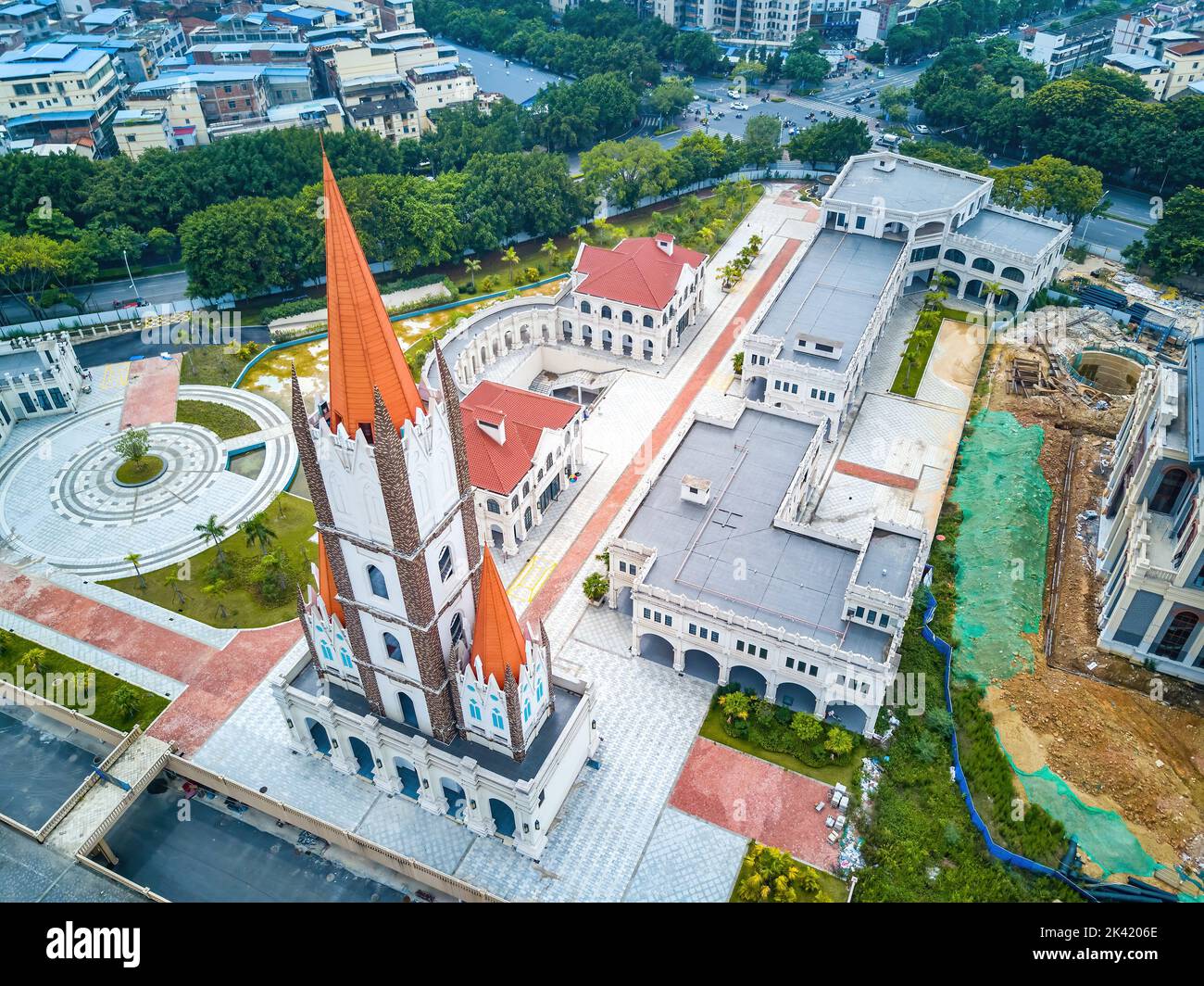 A red gothic steeple church building Stock Photo - Alamy