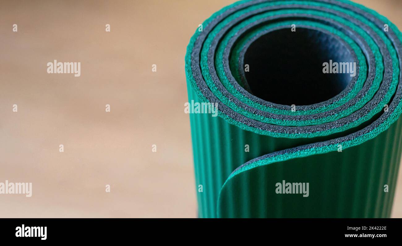 Roll yoga mat or mattress banner background Stock Photo - Alamy