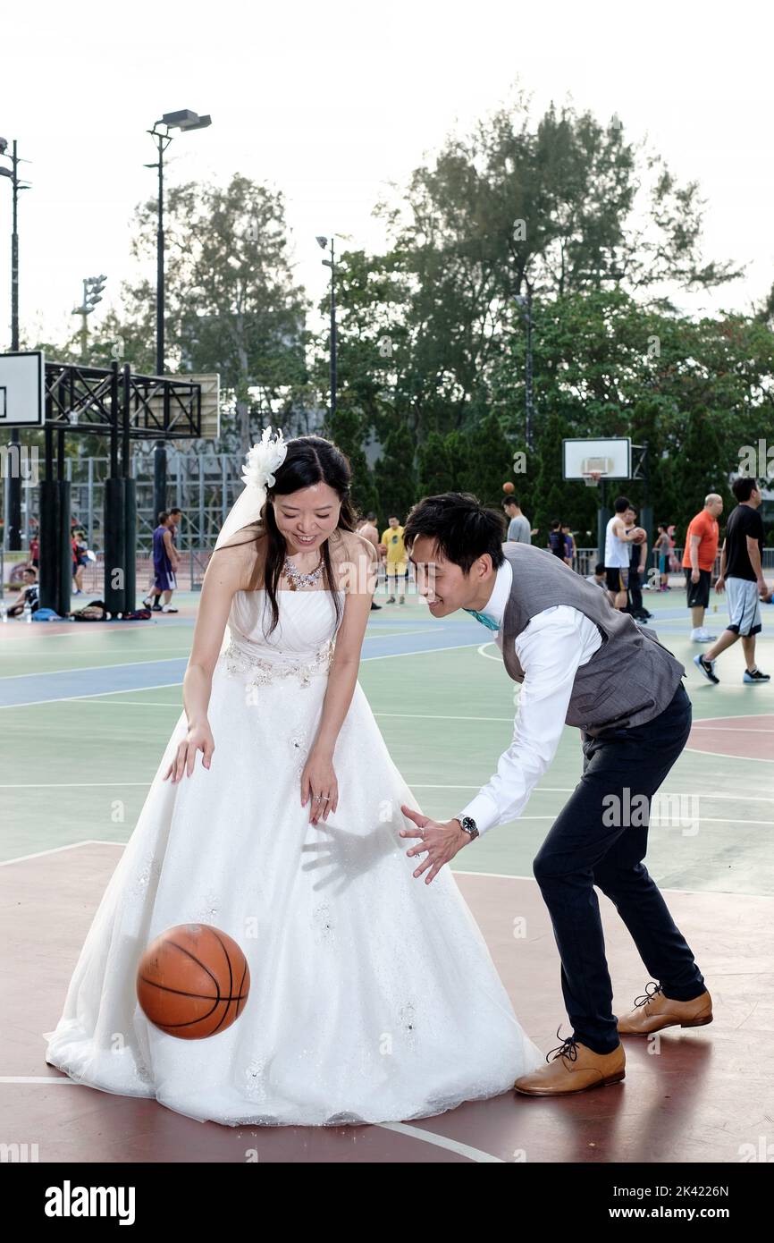 Bride and groom play basketball Stock Photo - Alamy