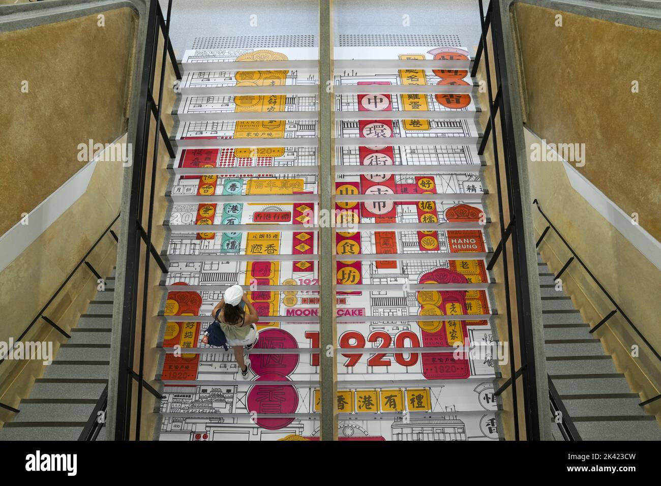 A woman going up stairs in Central Market. 18SEP22. SCMP / Sam Tsang ...