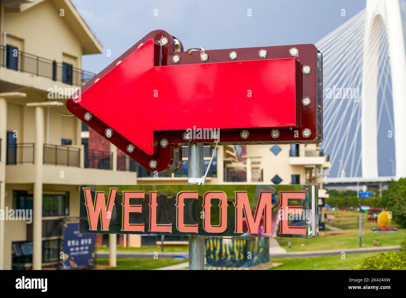 A welcome sign with a red arrow outdoors Stock Photo - Alamy