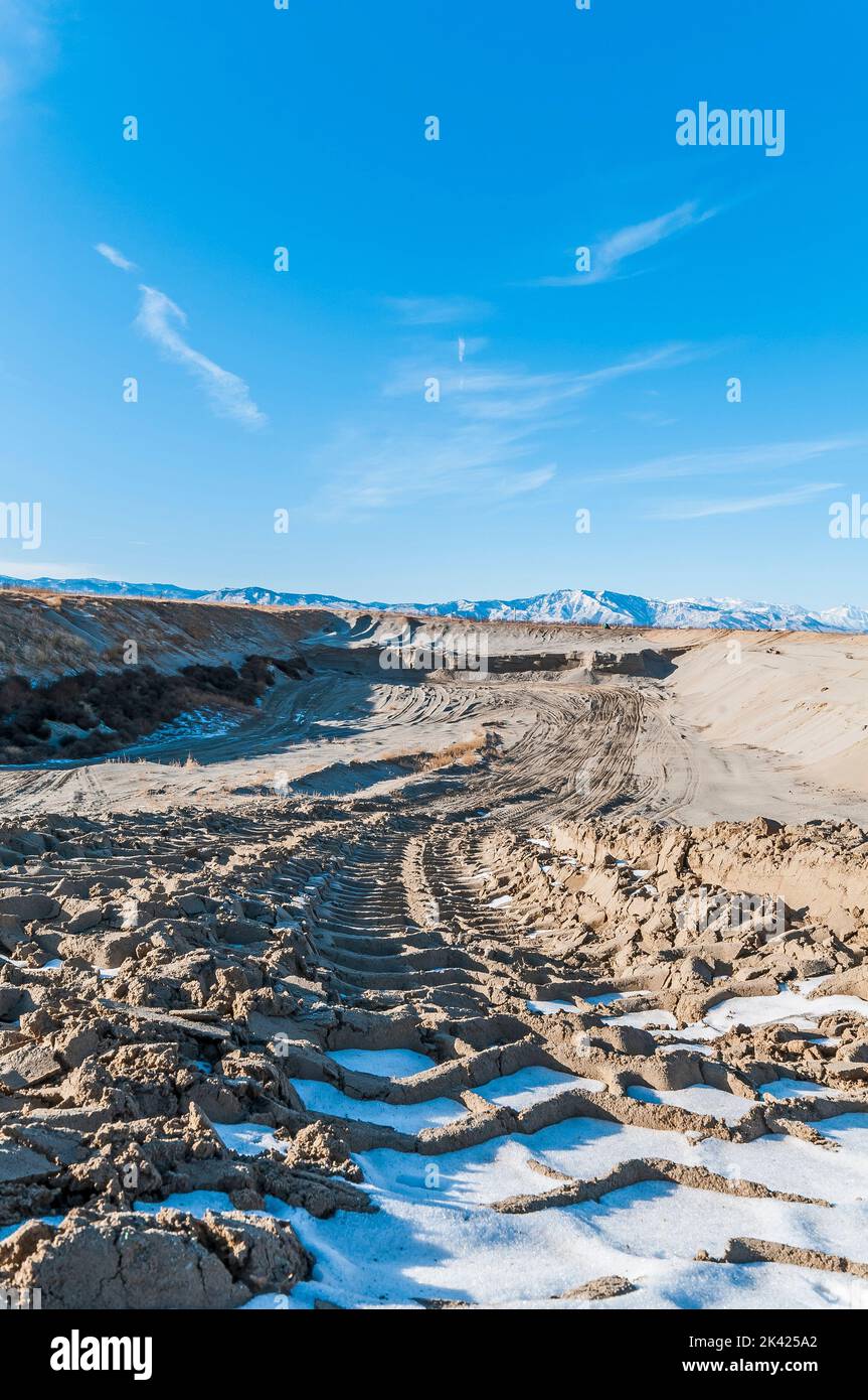 Tire and tread tracks are quite evident in the soil of an active solid ...