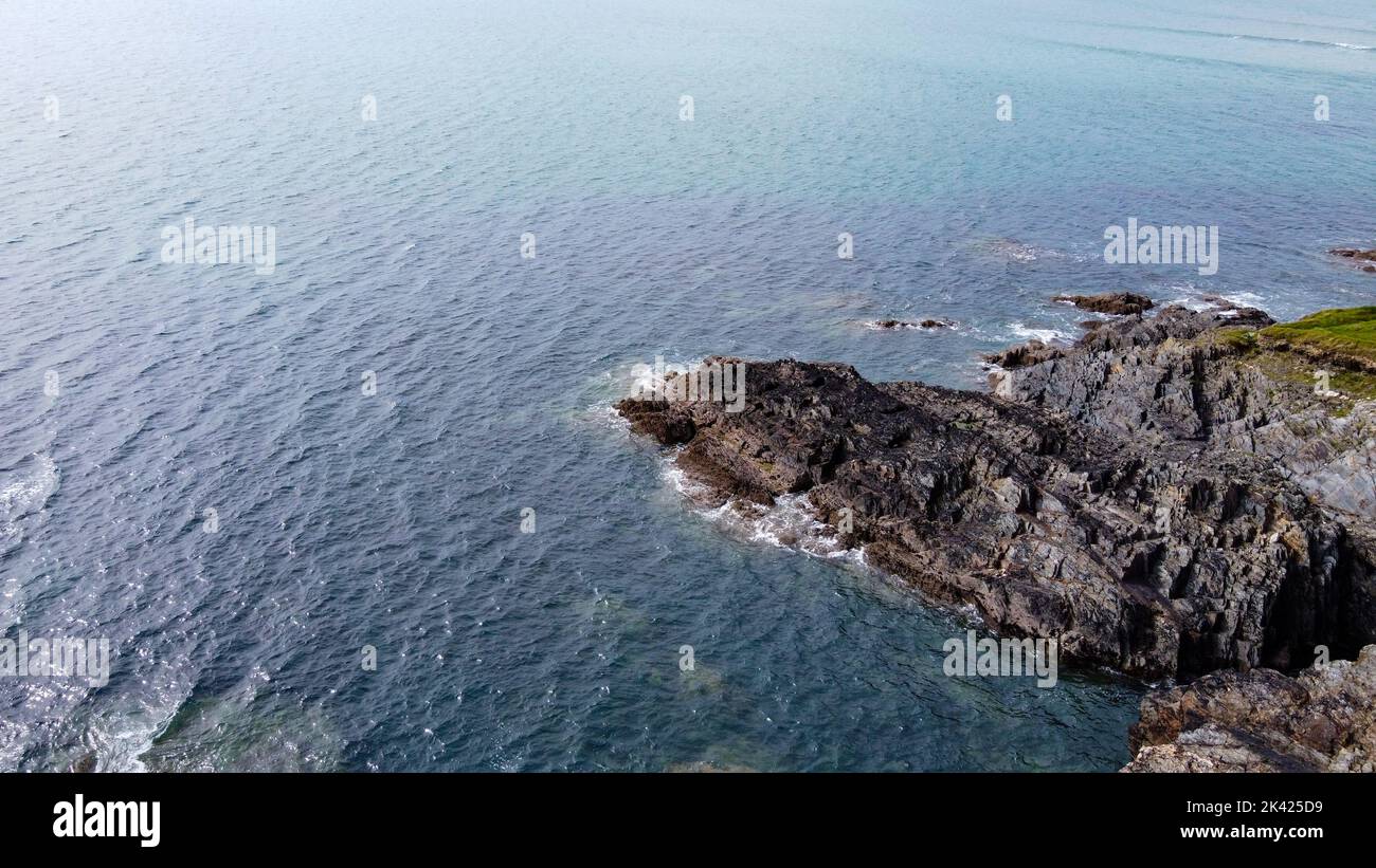 A large stone cape among the waters of the Atlantic Ocean, top view ...