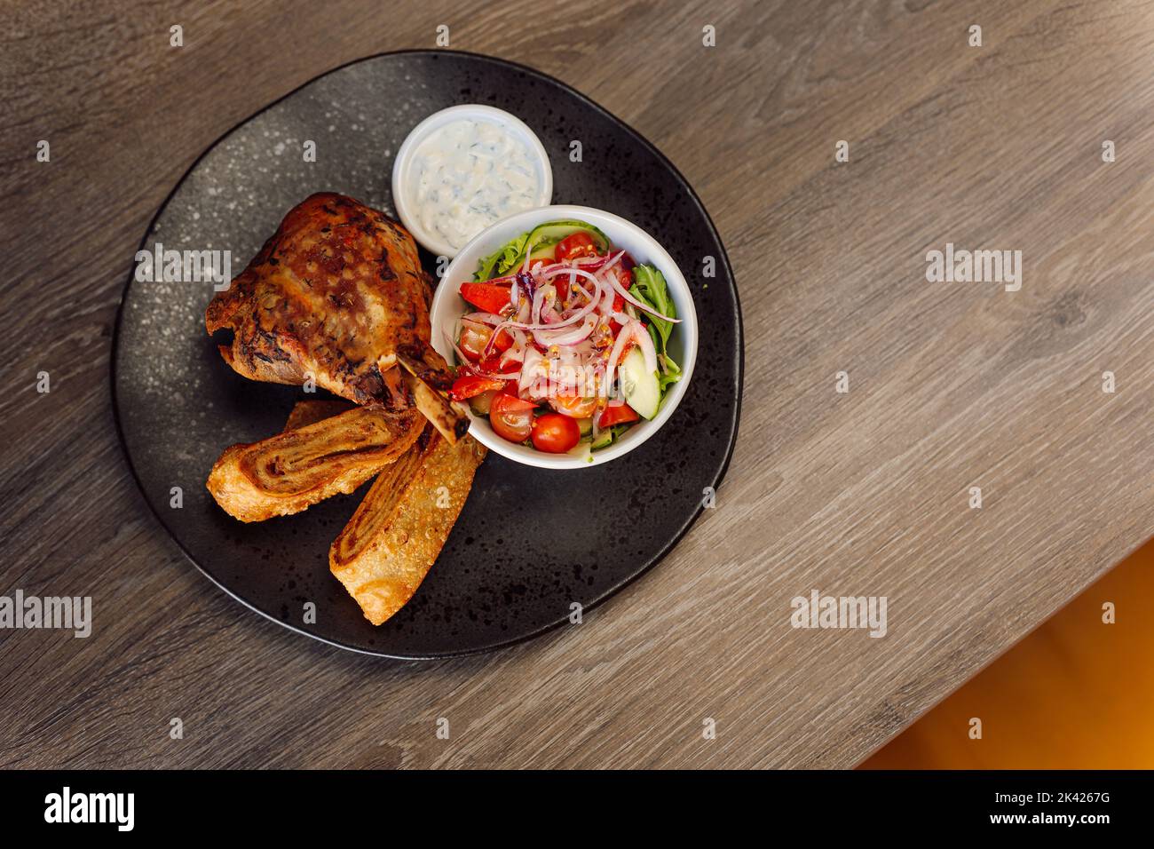 Delicious roasted duck with vegetable salad of cucumbers, greenery ...