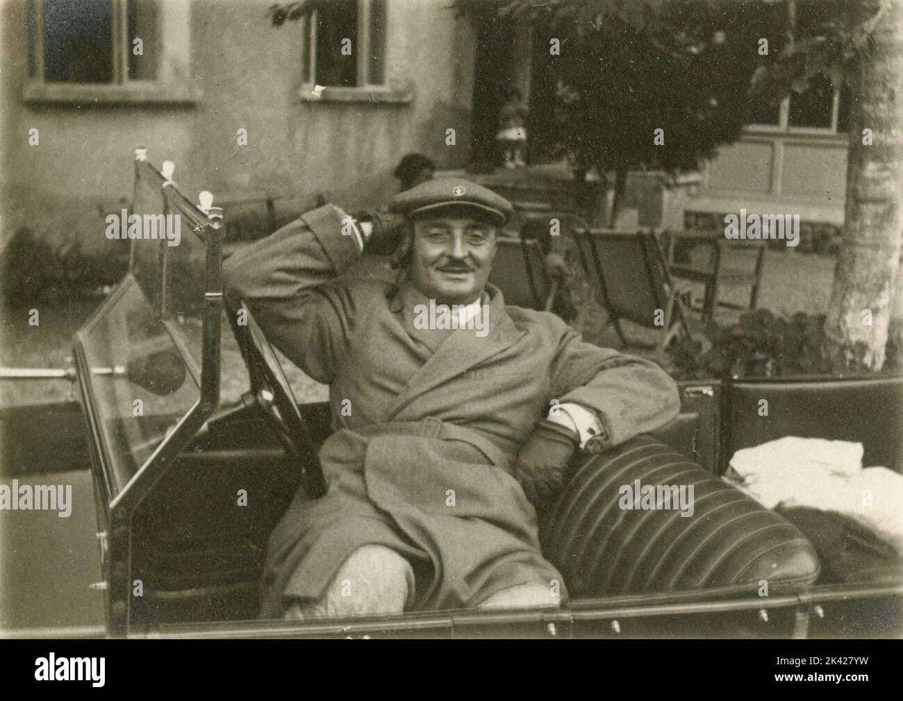 Man sitting in an old convertible car, Italy 1920s Stock Photo - Alamy
