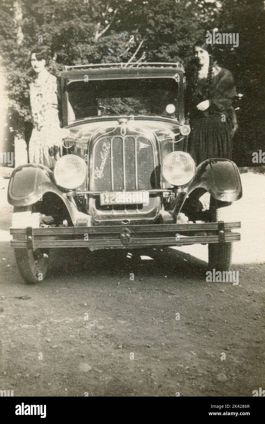 Two women on a Chandler Six car, Italy 1920s Stock Photo - Alamy