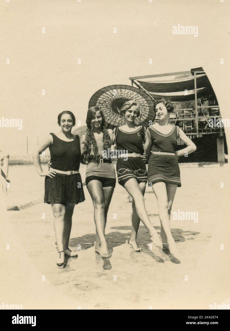Four women on the beach with vintage bathsuit, Italy 1920s Stock Photo ...