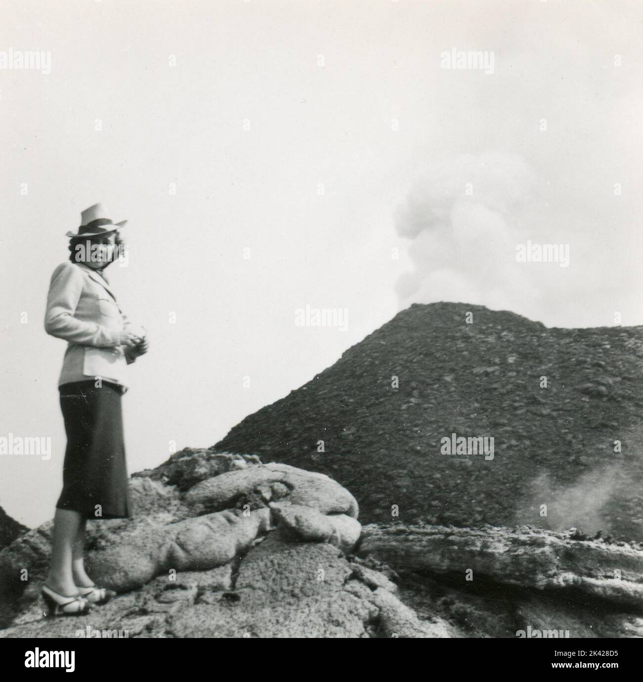 Woman with hat on the slopes of the Etna volcano, Italy 1930s Stock ...