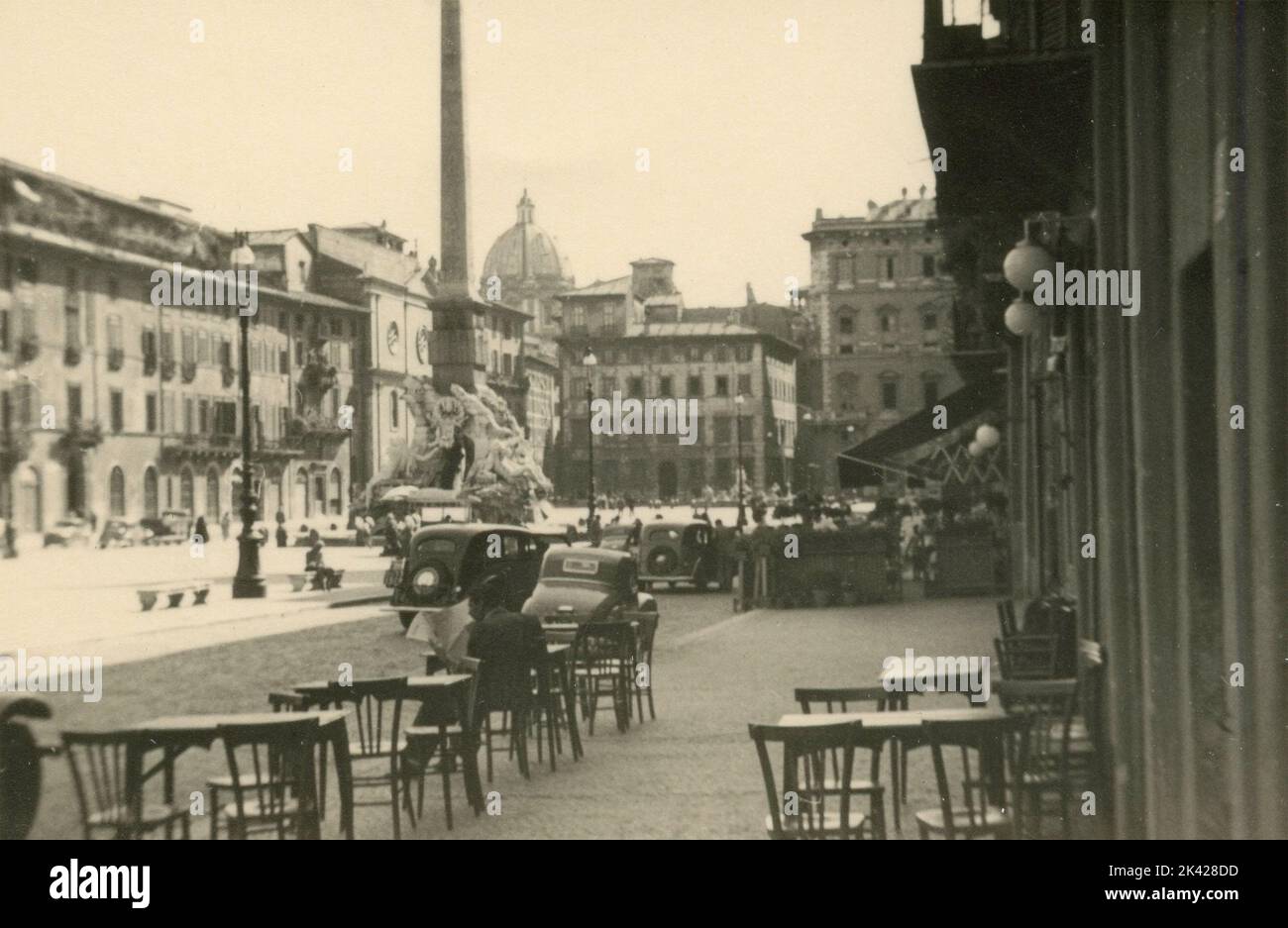 Bar tables and cars in Piazza Navona, Rome, Italy 1930s Stock Photo - Alamy