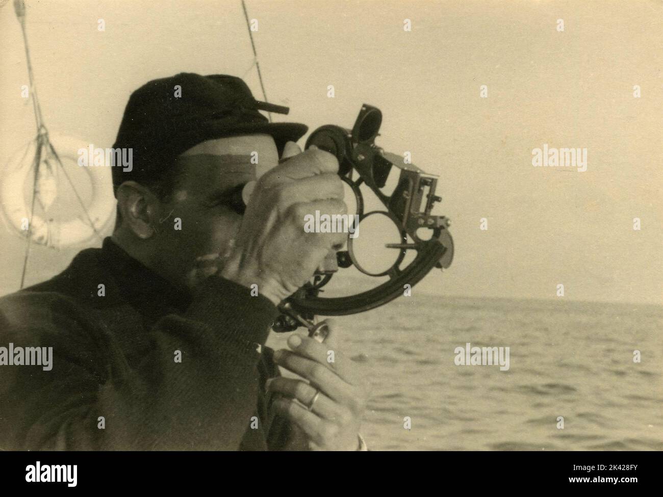 Sailor taking measurements with the sextant, Italy 1960s Stock Photo ...