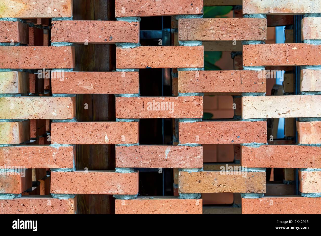 Close-up of decorative wall made of red bricks Stock Photo - Alamy