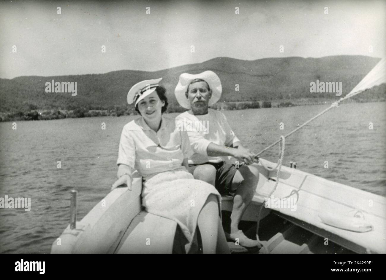 A couple in a small sailing boat, Italy 1940s Stock Photo - Alamy