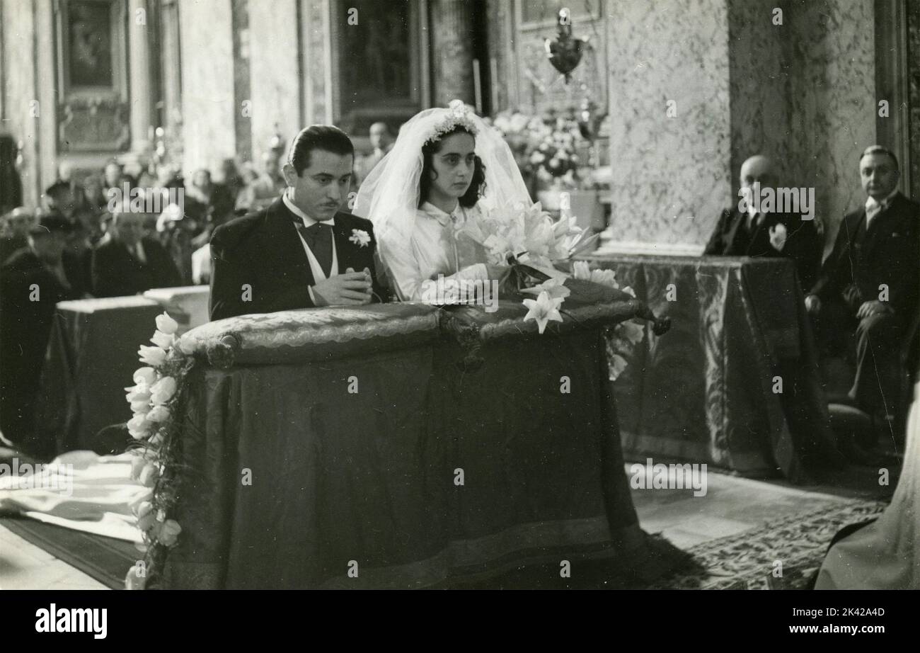 Sad couple getting married in the church, Italy 1950s Stock Photo - Alamy