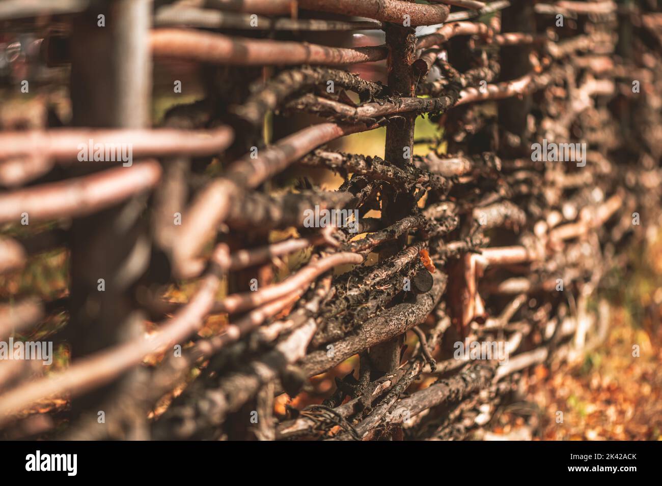 A fence made of woven branches to create an environmentally sustainable ...