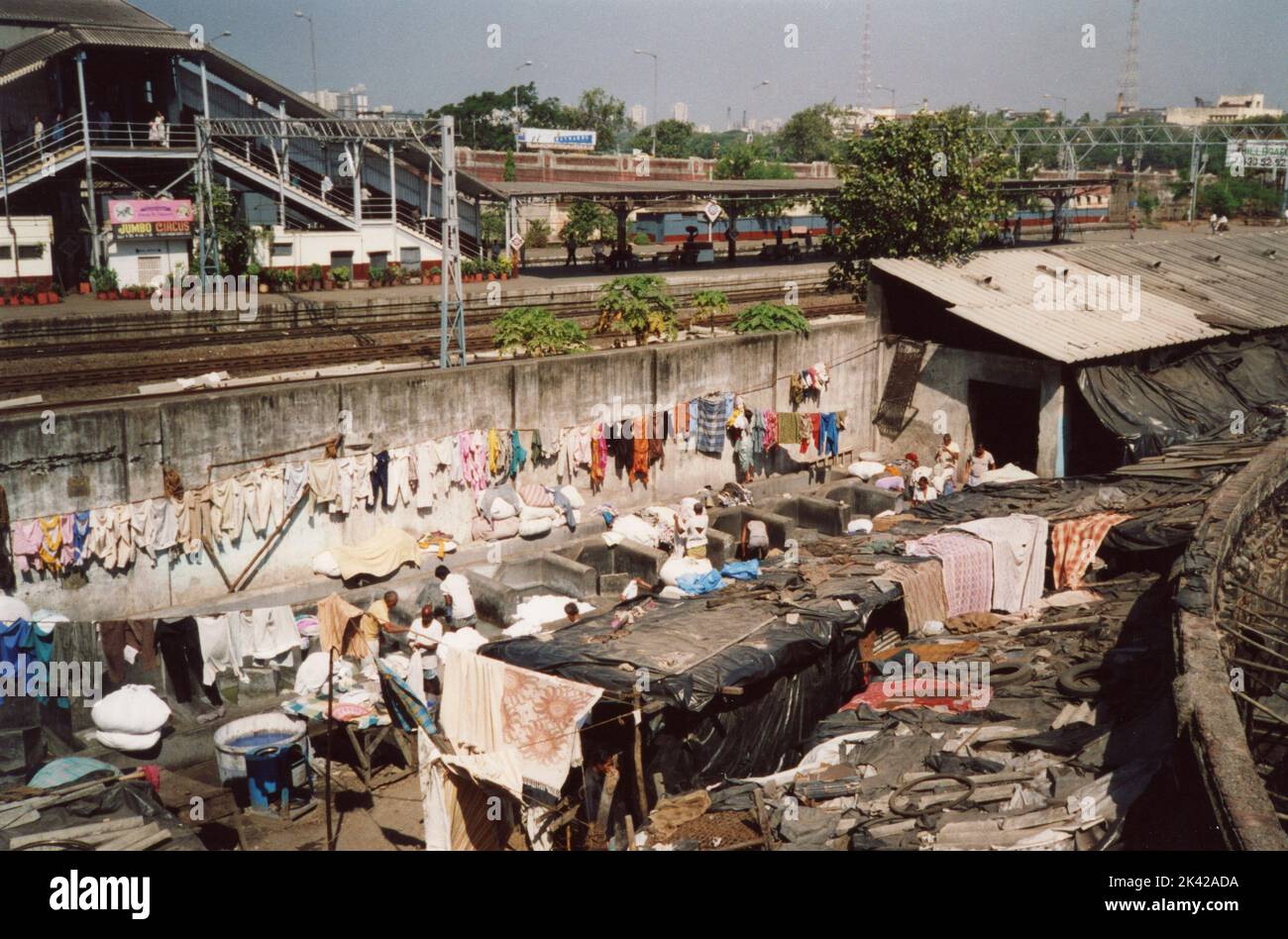 View of slum housing next to railway station, Mumbai, India 1990s Stock ...