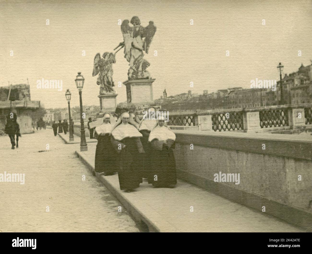 Group of nuns walking in the Lungotevere near Castel Sant'Angelo, Rome ...