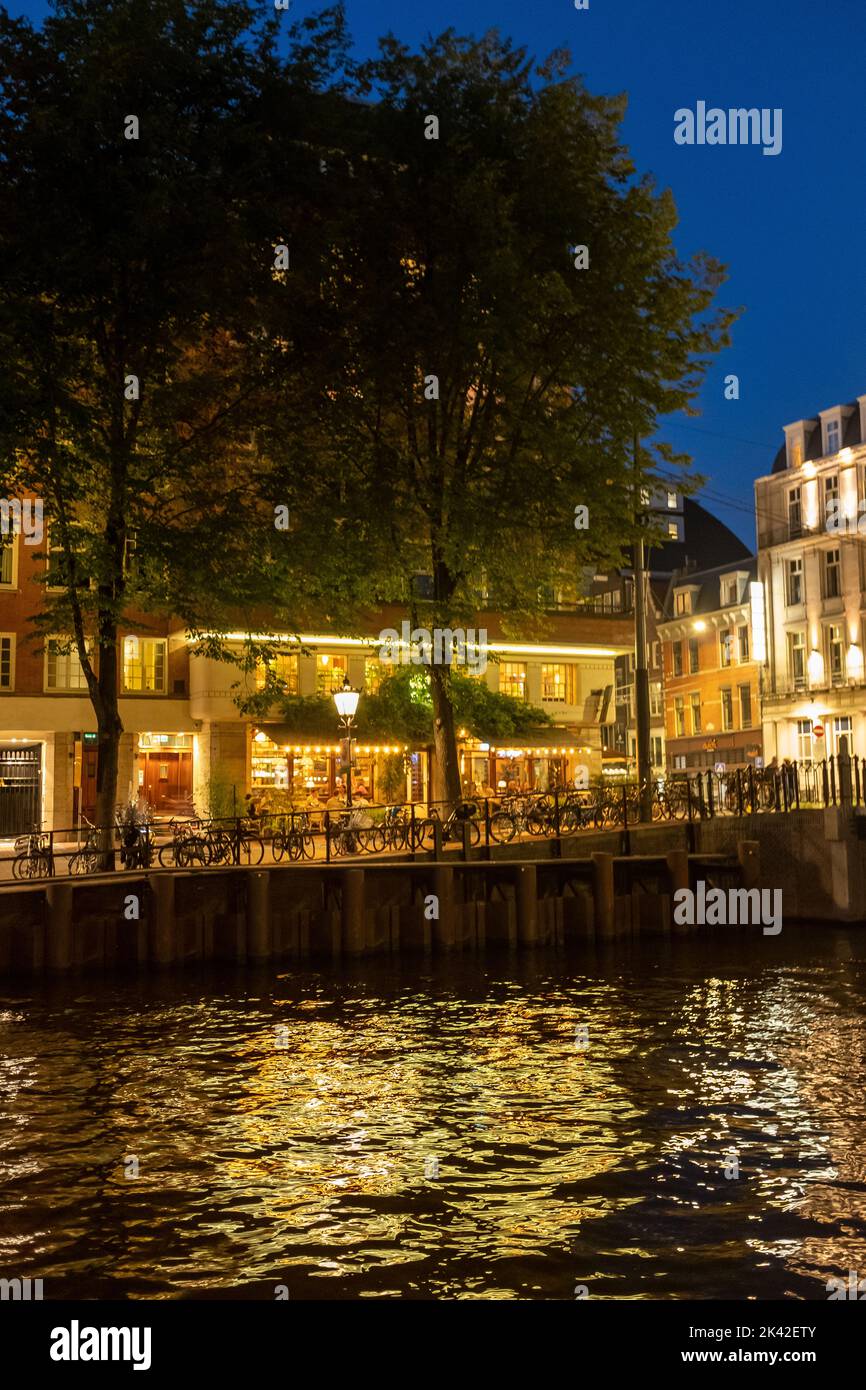 Canal and bar at night, Amsterdam, The Netherlands Stock Photo - Alamy