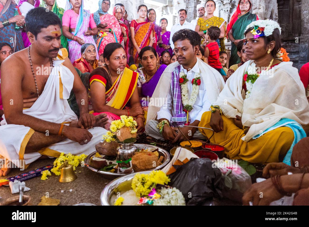 Hampi, Karnataka, India: A brahmin priest conducts a Hindu wedding inside the Sree Virupaksha ...