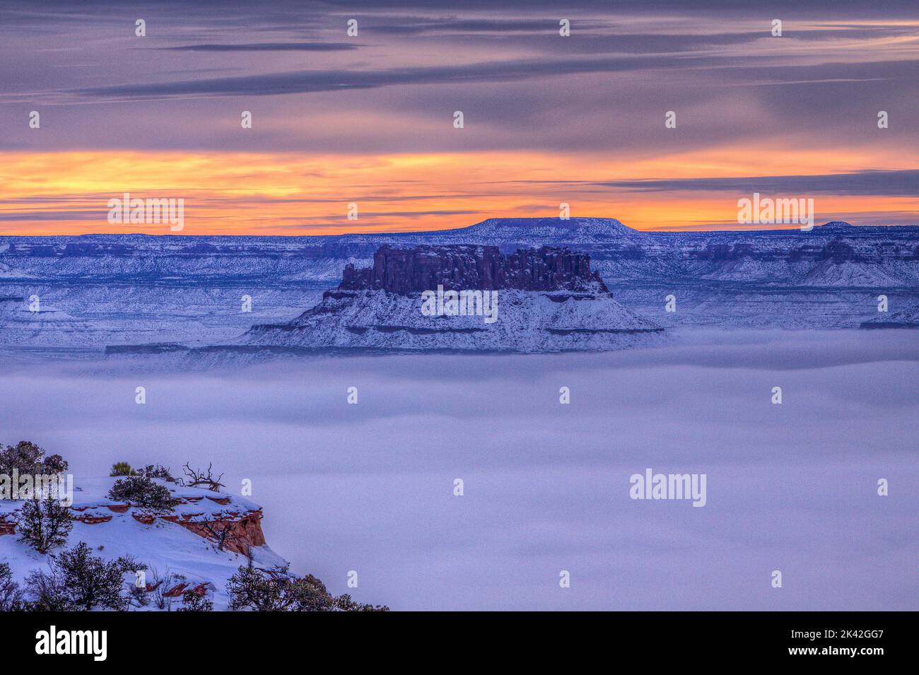 North Point & the Orange Cliffs rise above the fog in the Green River ...