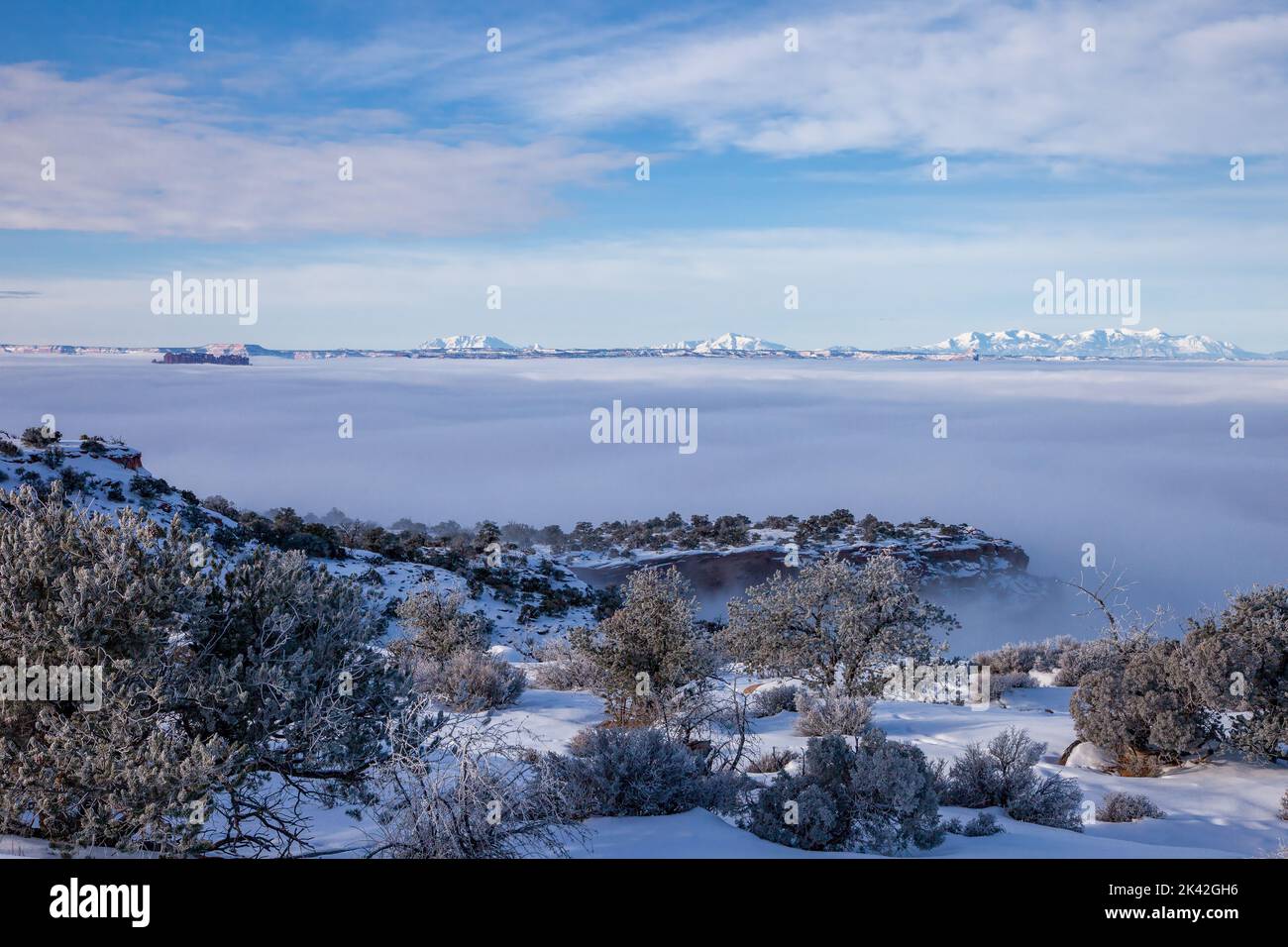 A sea of fog fills the Green River Basin the tops of the Orange Cliffs ...