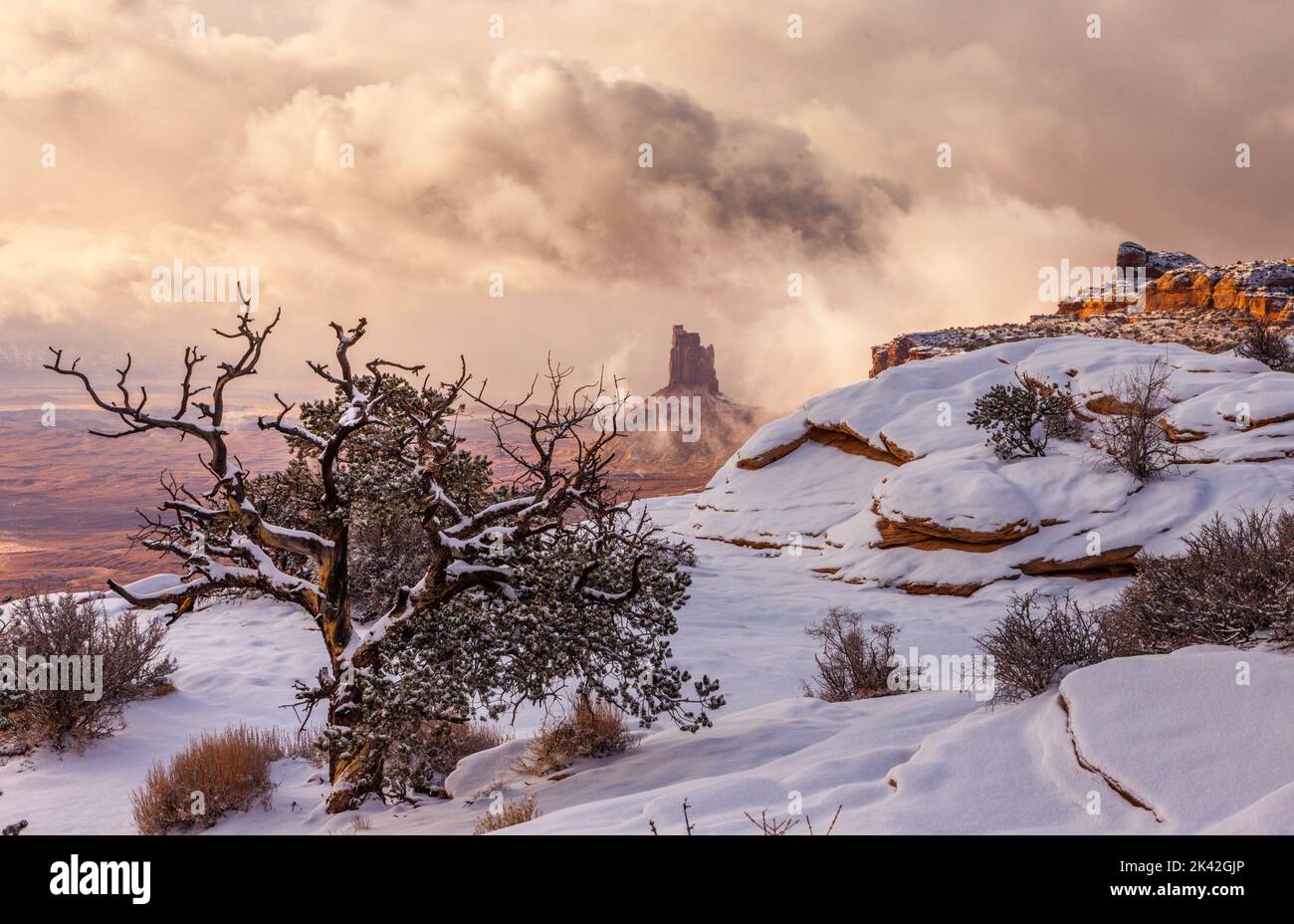 Winter storm clouds over the Candlestick Tower in Canyonlands National ...