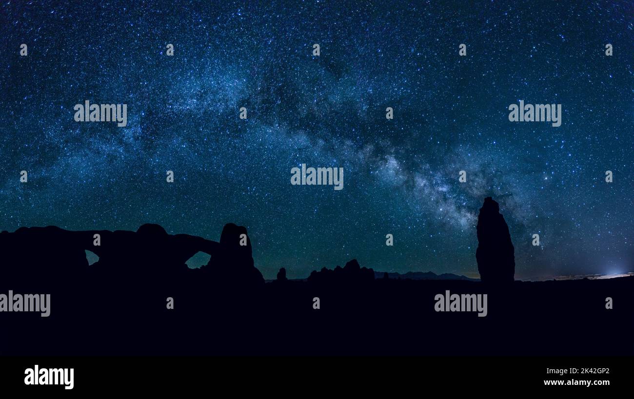 Milky Way Galaxy over silhouettes of a sandstone spire and the North ...