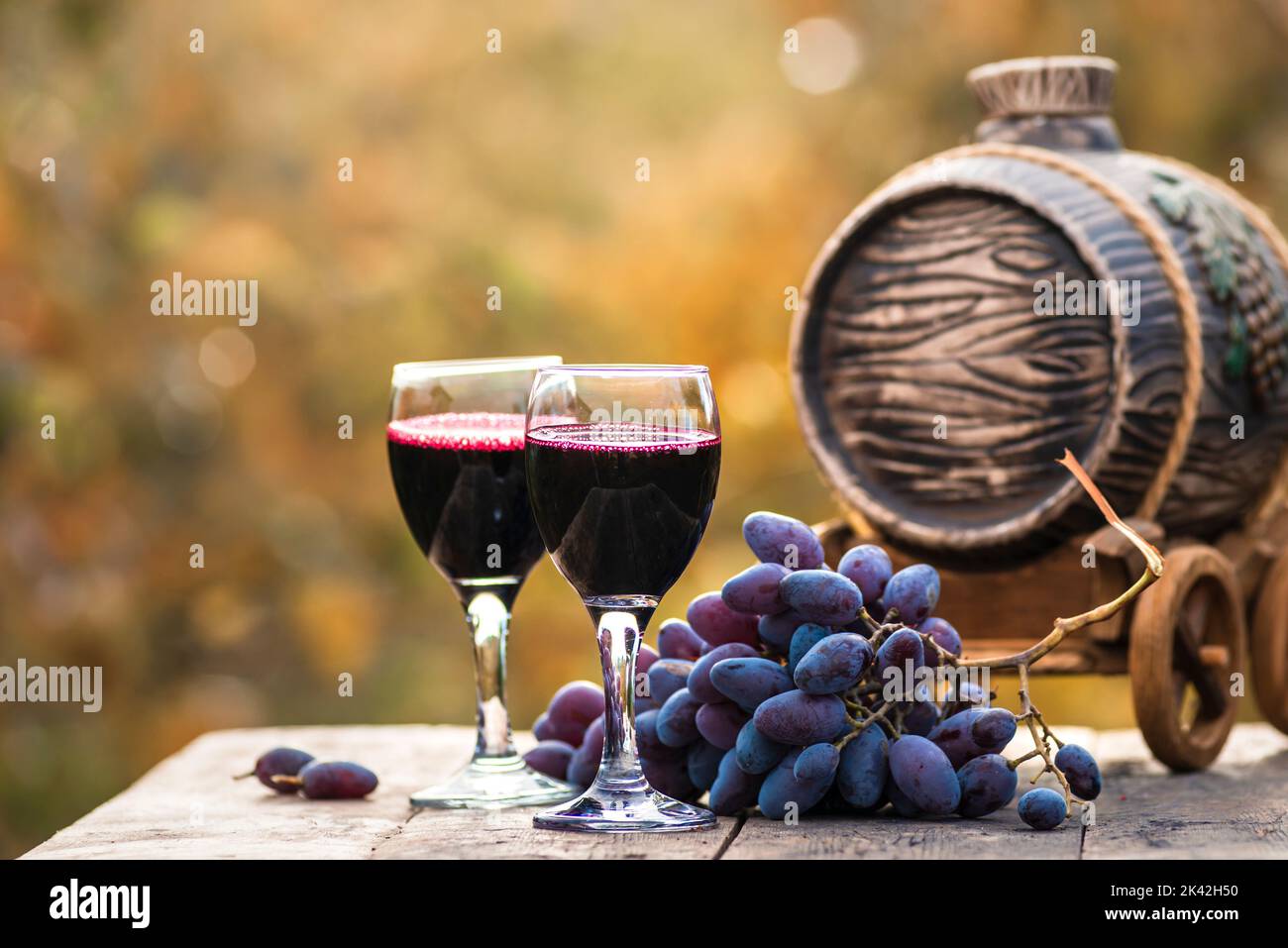 red Wine Glasses With Barrel grape In Vineyard morning autumn Beautiful ...