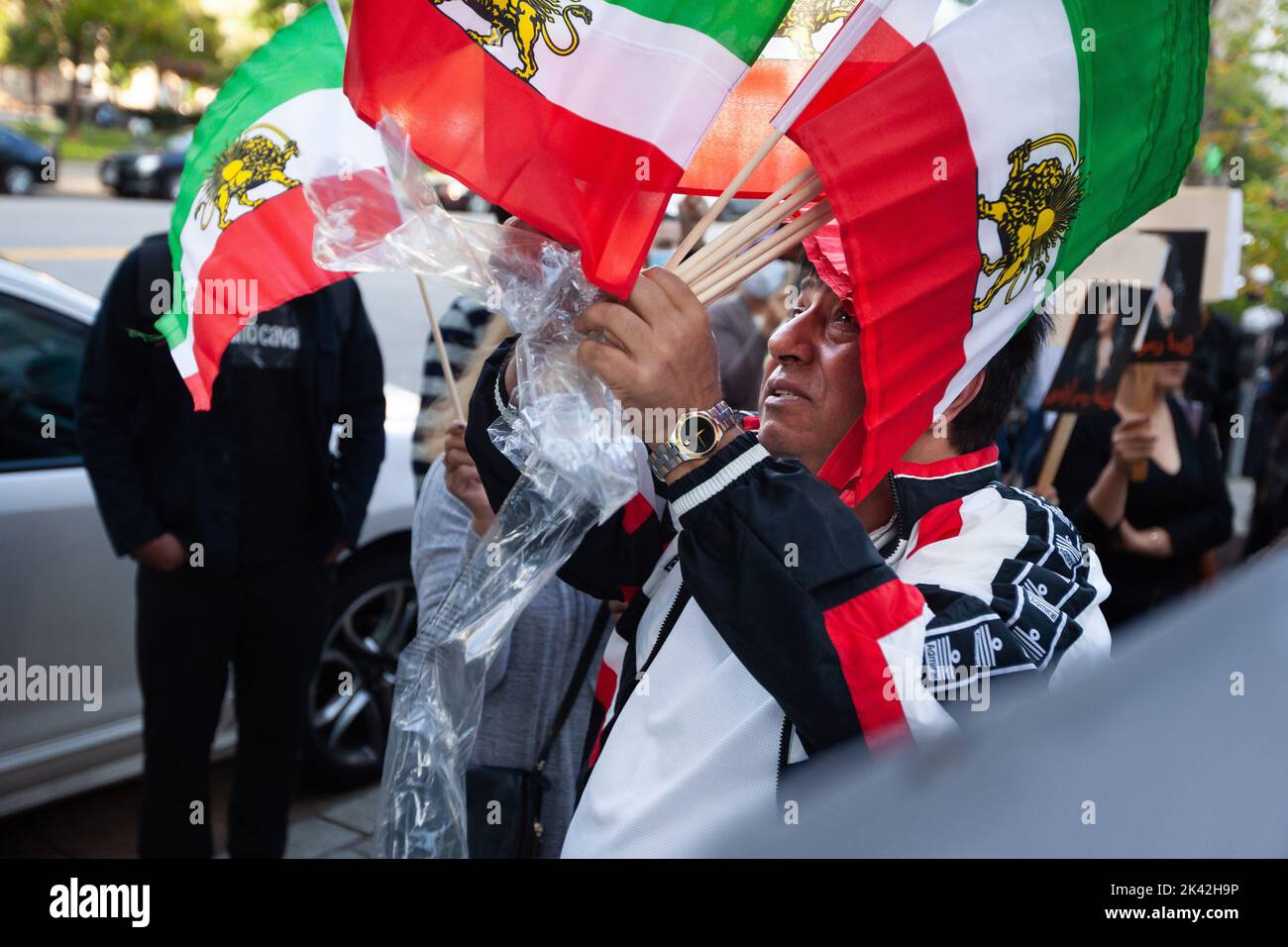 Washington, United States. 28th Sep, 2022. Protesters hold flags and ...