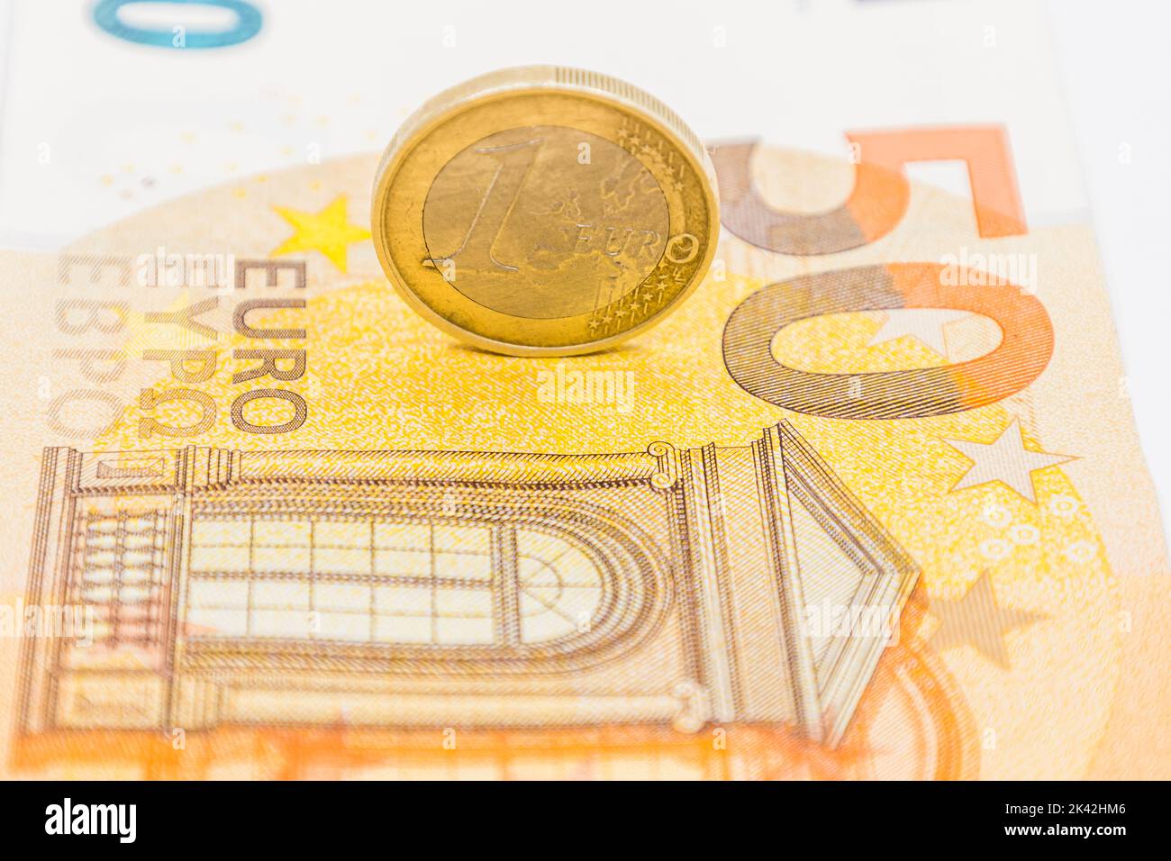 One Euro coin on the 50 Euro note banknote Stock Photo - Alamy