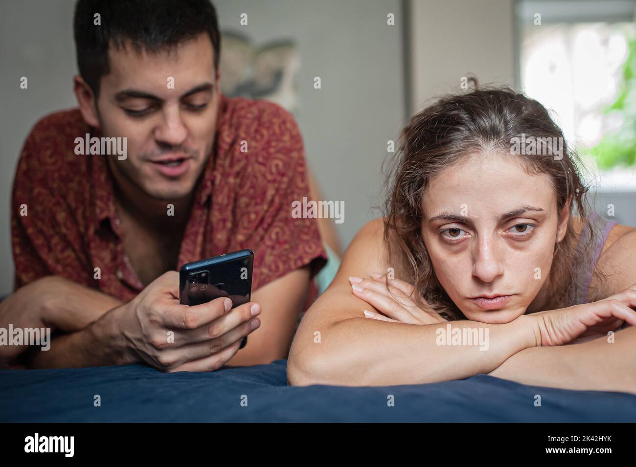 Concept of adultery and infidelity. Shocked and surprised jealous girl in trouble with her ...