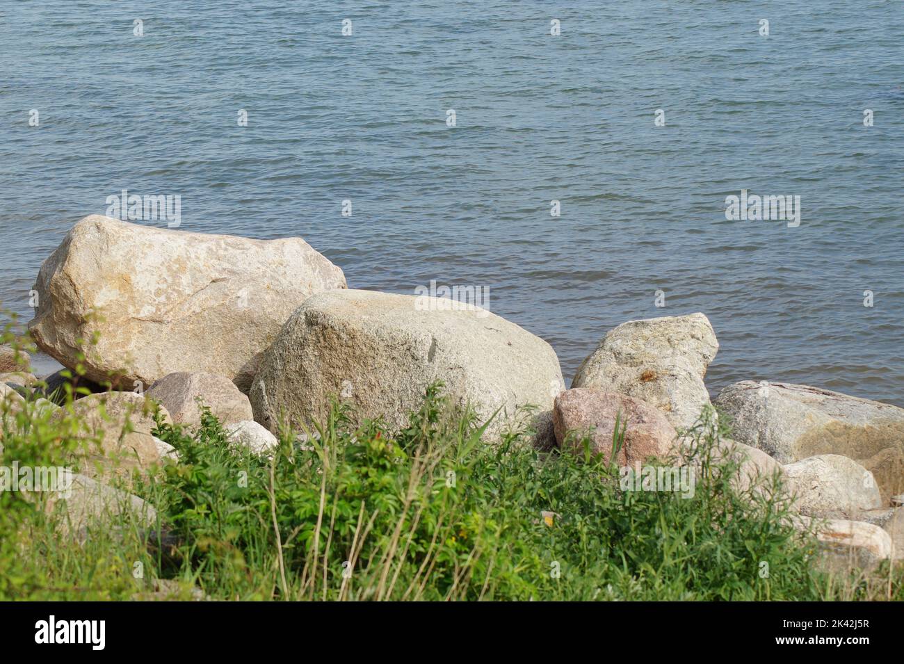 large stones rocks for coastal protection Stock Photo - Alamy