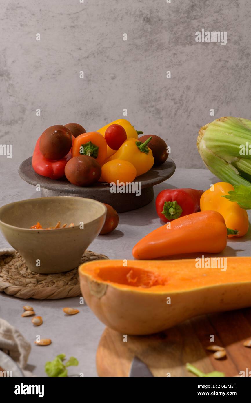 Autumn vegetables arranged on a kitchen worktop while preparing a ...