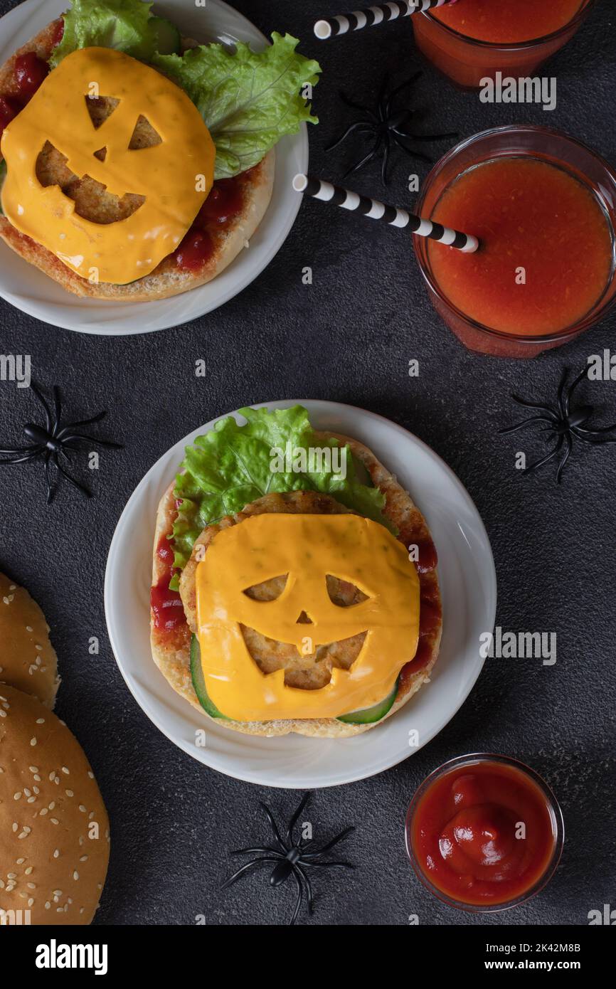 Funny monster chicken burgers with toast cheese, ketchup and cucumber ...