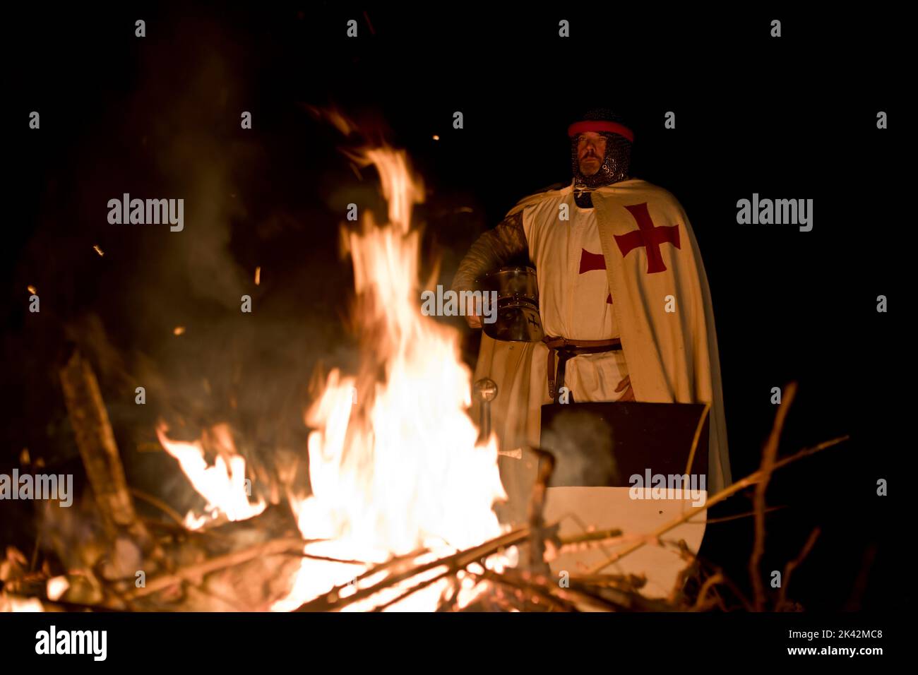 Templar Knight by fire, burning perhaps of fallen brothers in arms ...