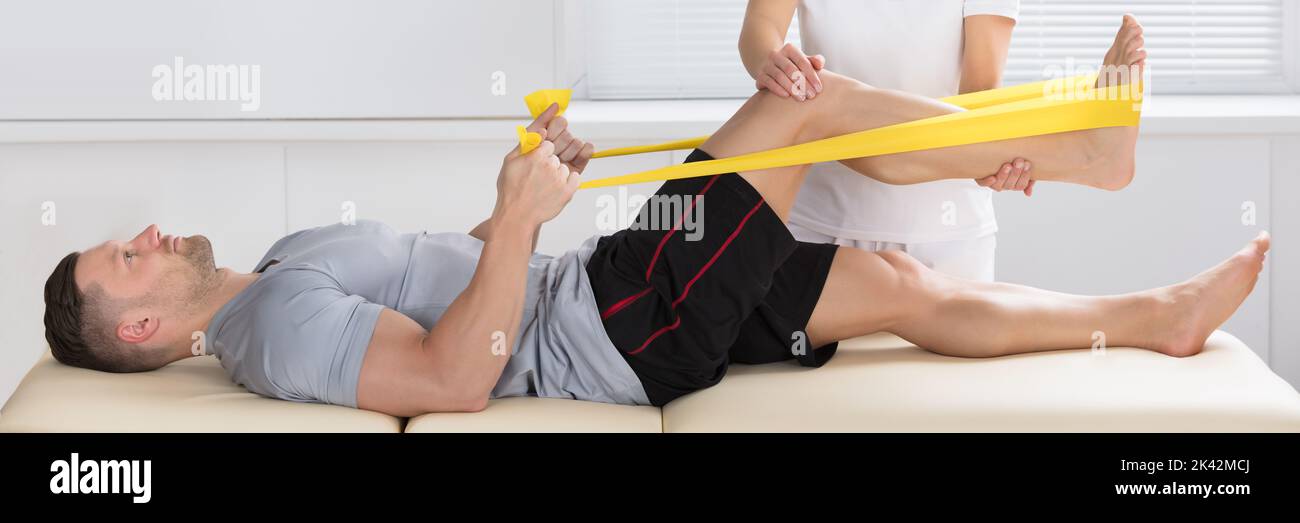 Therapy Band Exercise. Therapeutic Physio Rehab Training Stock Photo ...