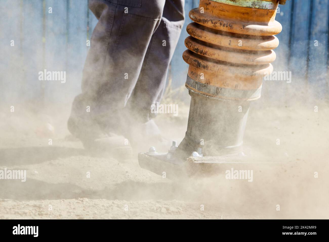 Construction tool handled by worker on dust Stock Photo - Alamy