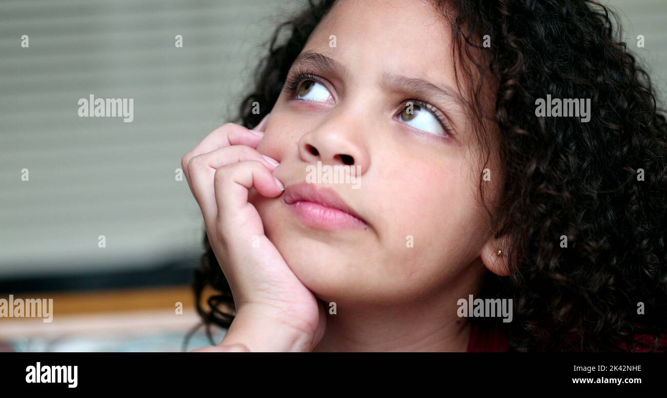 Child thinking about solution, pensive kid thoughtful girl Stock Photo ...