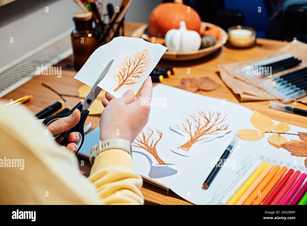 Autumn craft for adults. Faceless portrait of woman drawing autumn ...