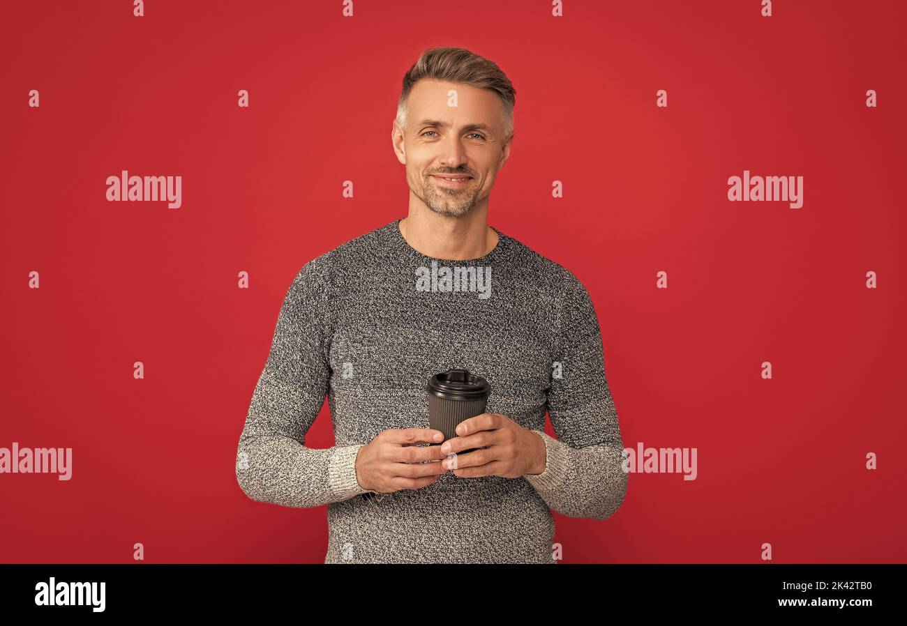 male fashion model hold cup. winter fashion. morning coffee. positive ...